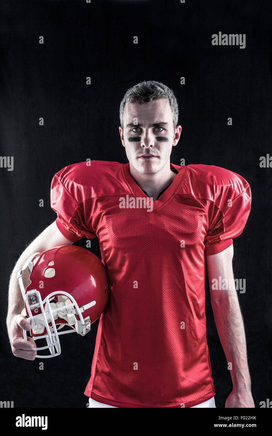 A serious american football player looking at camera Stock Photo - Alamy