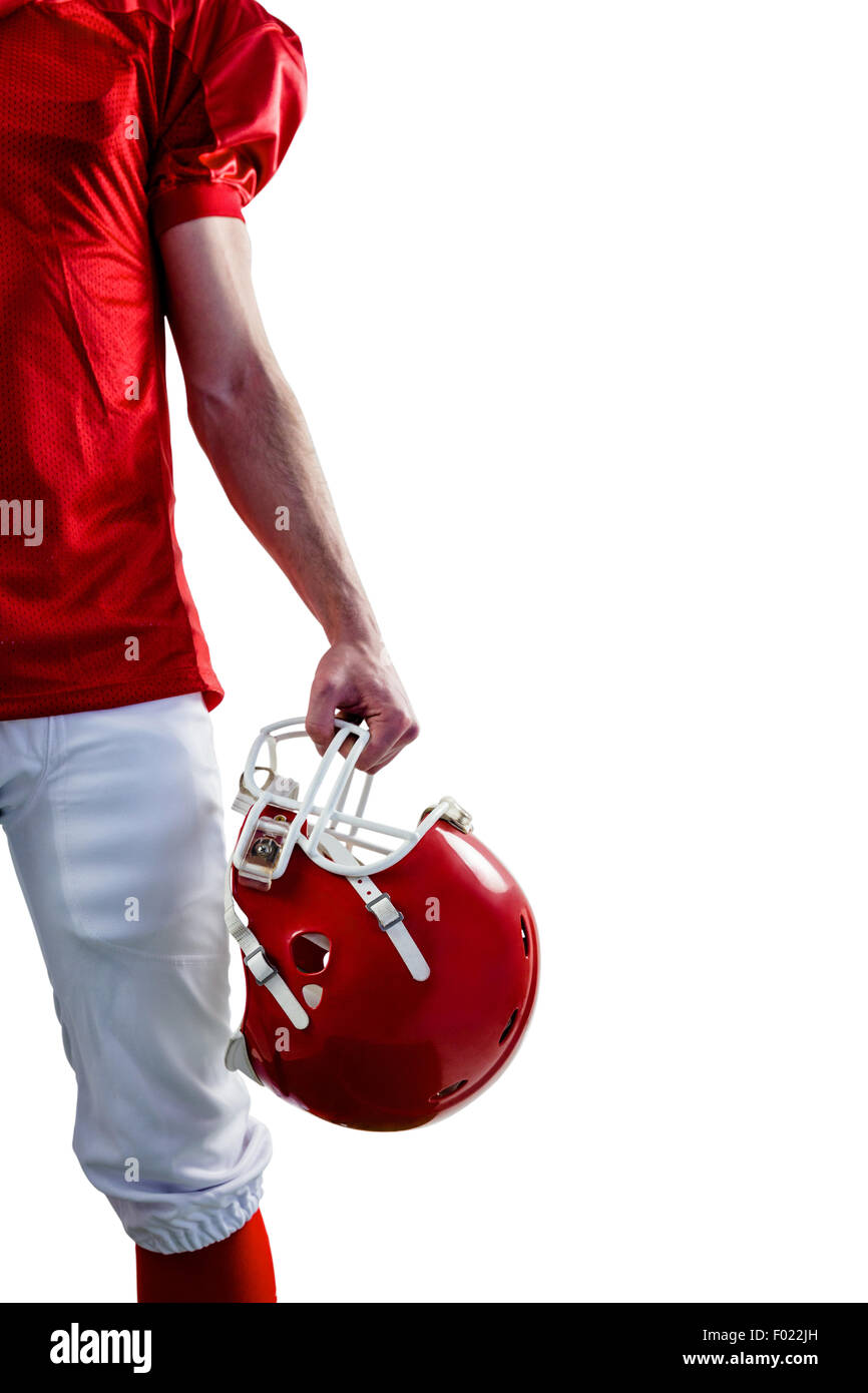 An american football player taking his helmet on hand Stock Photo - Alamy