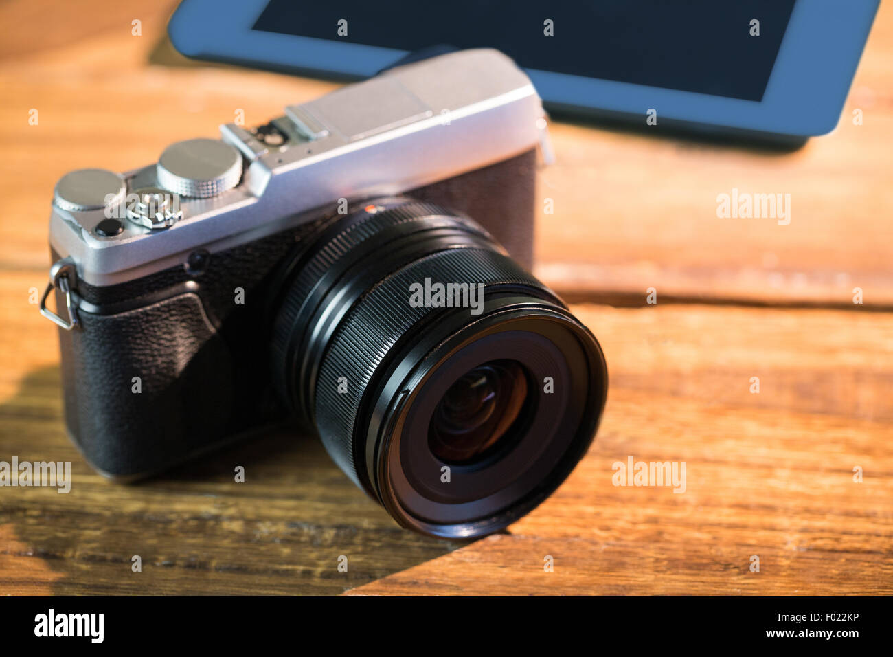 A beautiful brown fashioned camera next smartphone Stock Photo - Alamy