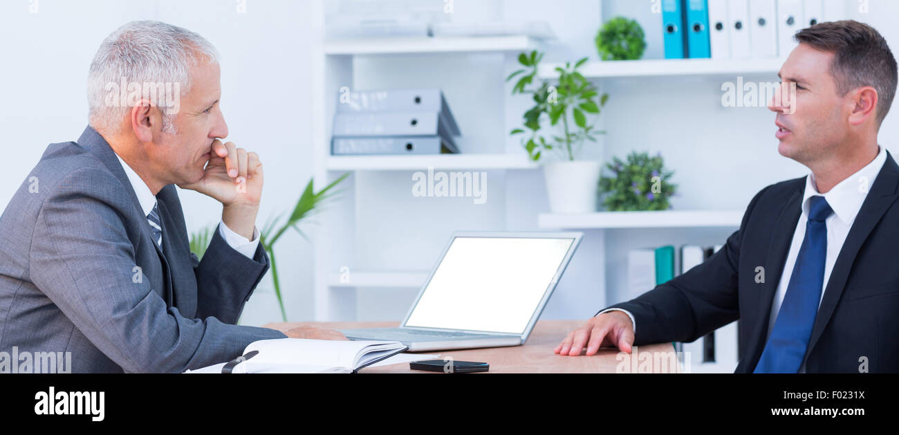 Two businessmen speaking and working Stock Photo - Alamy