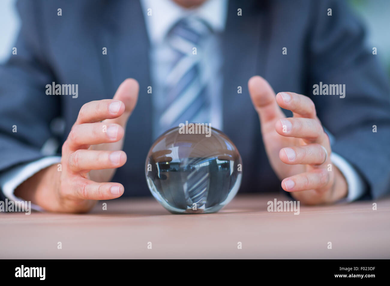 Businessman forecasting a crystal ball Stock Photo - Alamy
