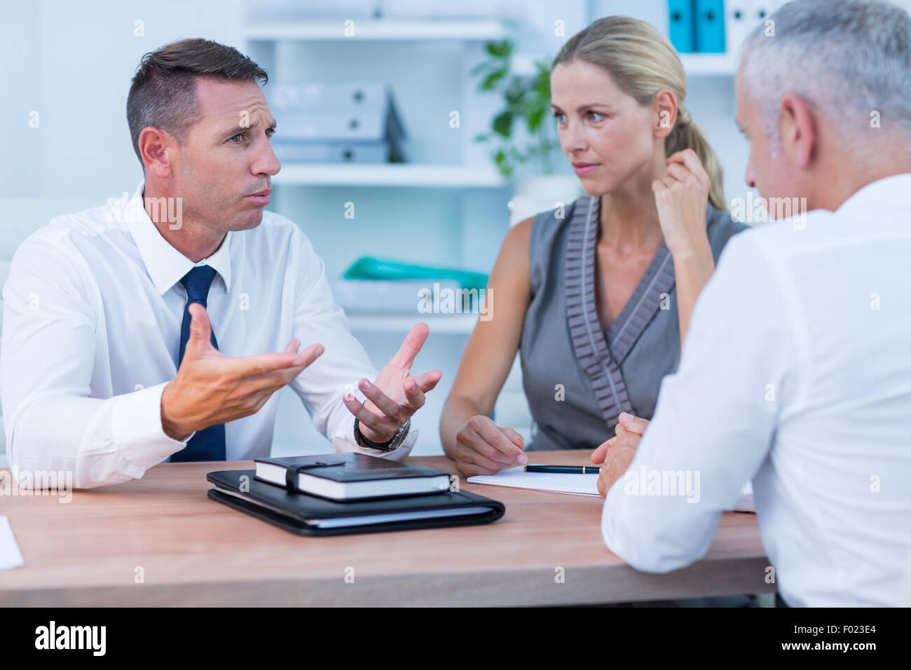 Business people speaking at meeting Stock Photo - Alamy
