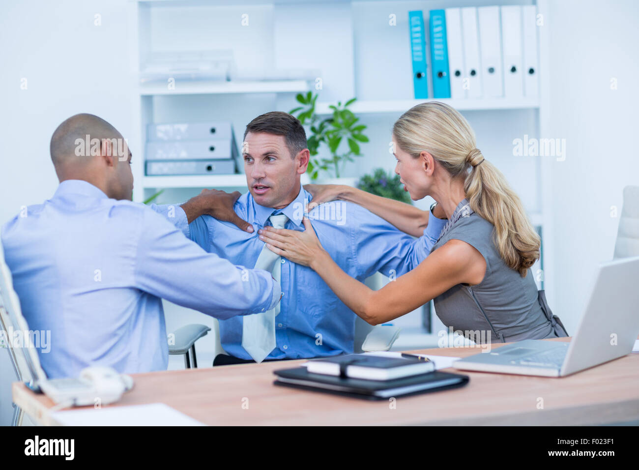 Business partners fighting together Stock Photo - Alamy