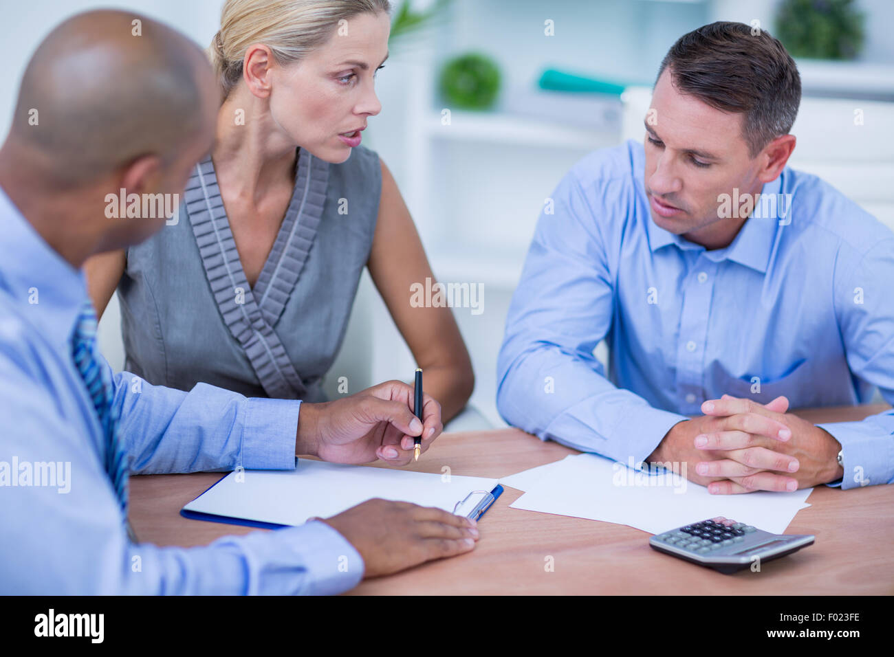 A business team brainstorming together Stock Photo - Alamy