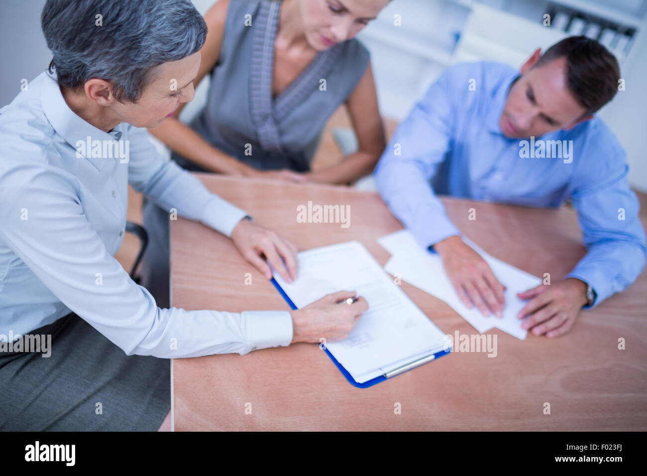 A business team brainstorming together Stock Photo - Alamy