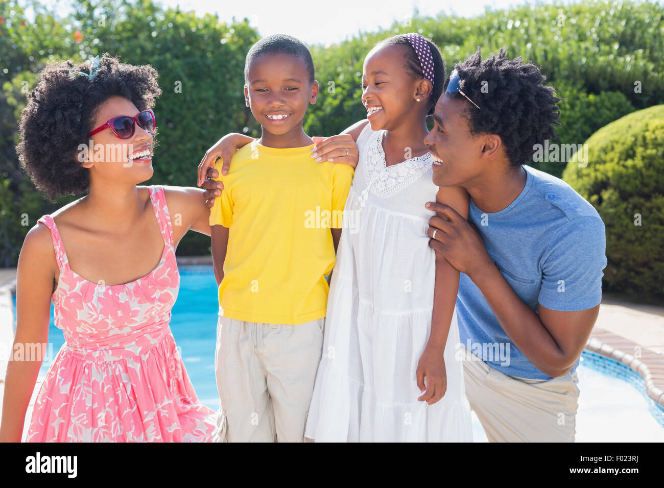 Happy family smiling at each other Stock Photo - Alamy
