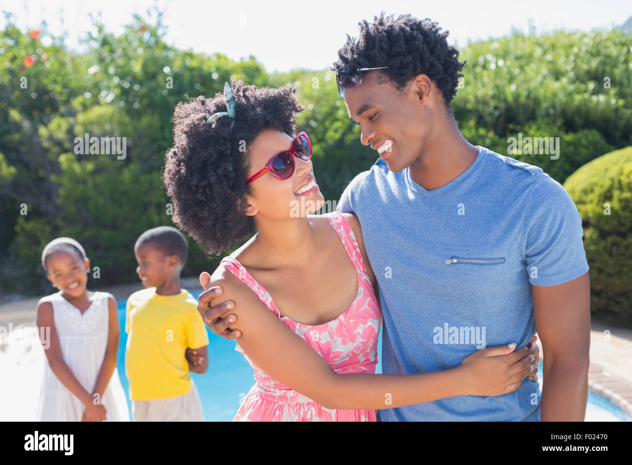 Happy parents smiling at each other Stock Photo - Alamy