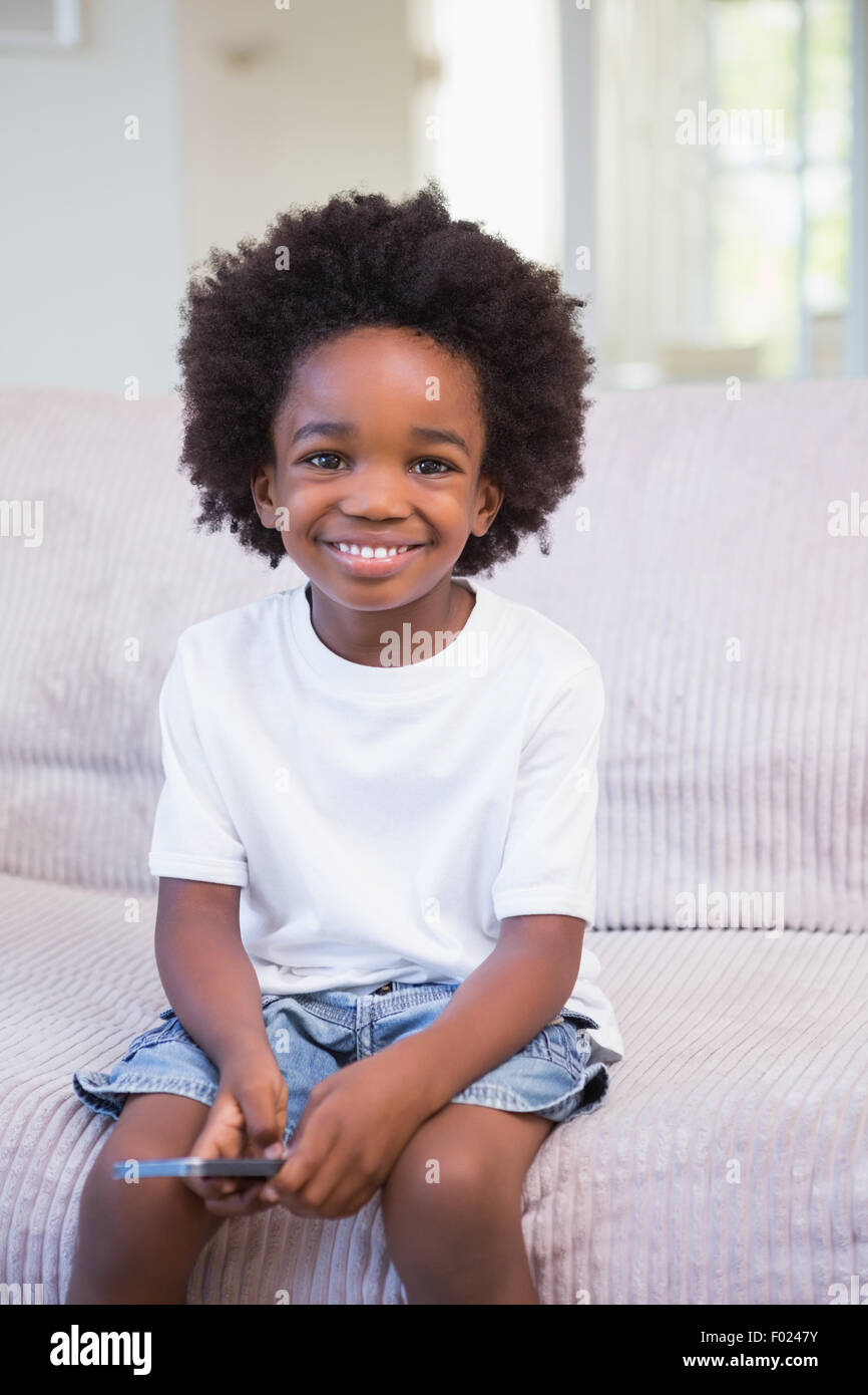 Portrait of a little boy using technology Stock Photo - Alamy