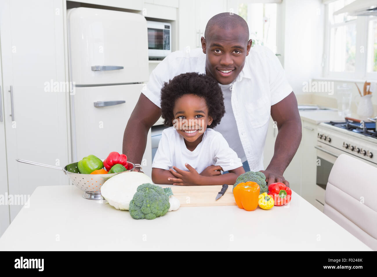 Boy cooking vegetables hi-res stock photography and images - Alamy