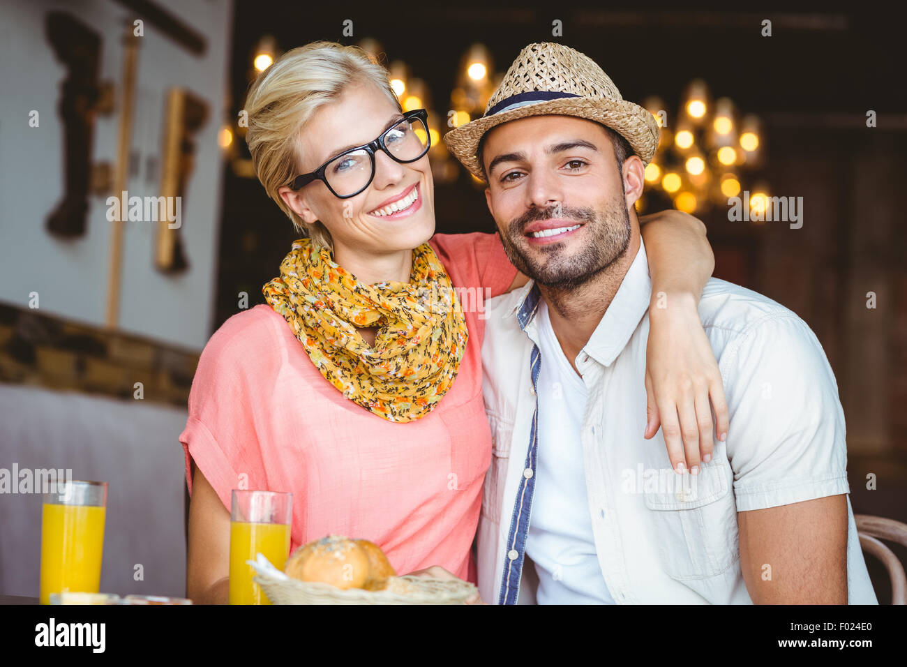 Cute couple on a date looking at the camera Stock Photo - Alamy