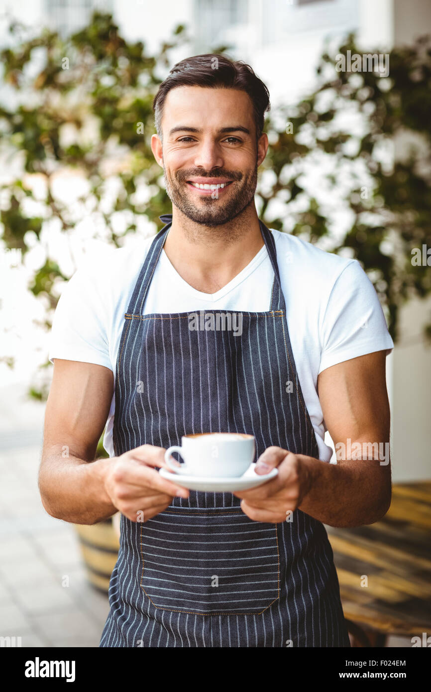 Handsome waiter smiling at camera Stock Photo - Alamy