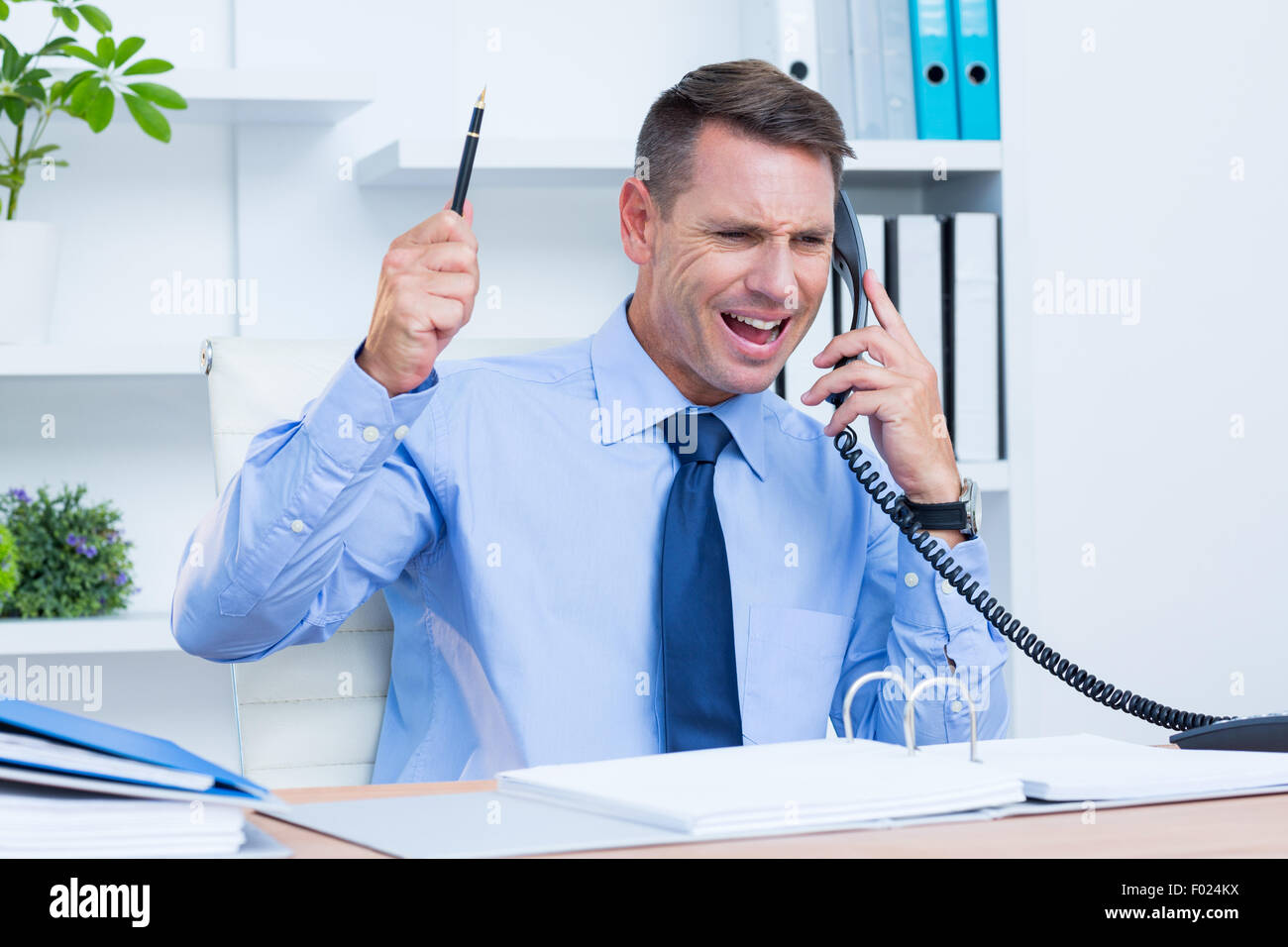Angry man at the desk hi-res stock photography and images - Alamy