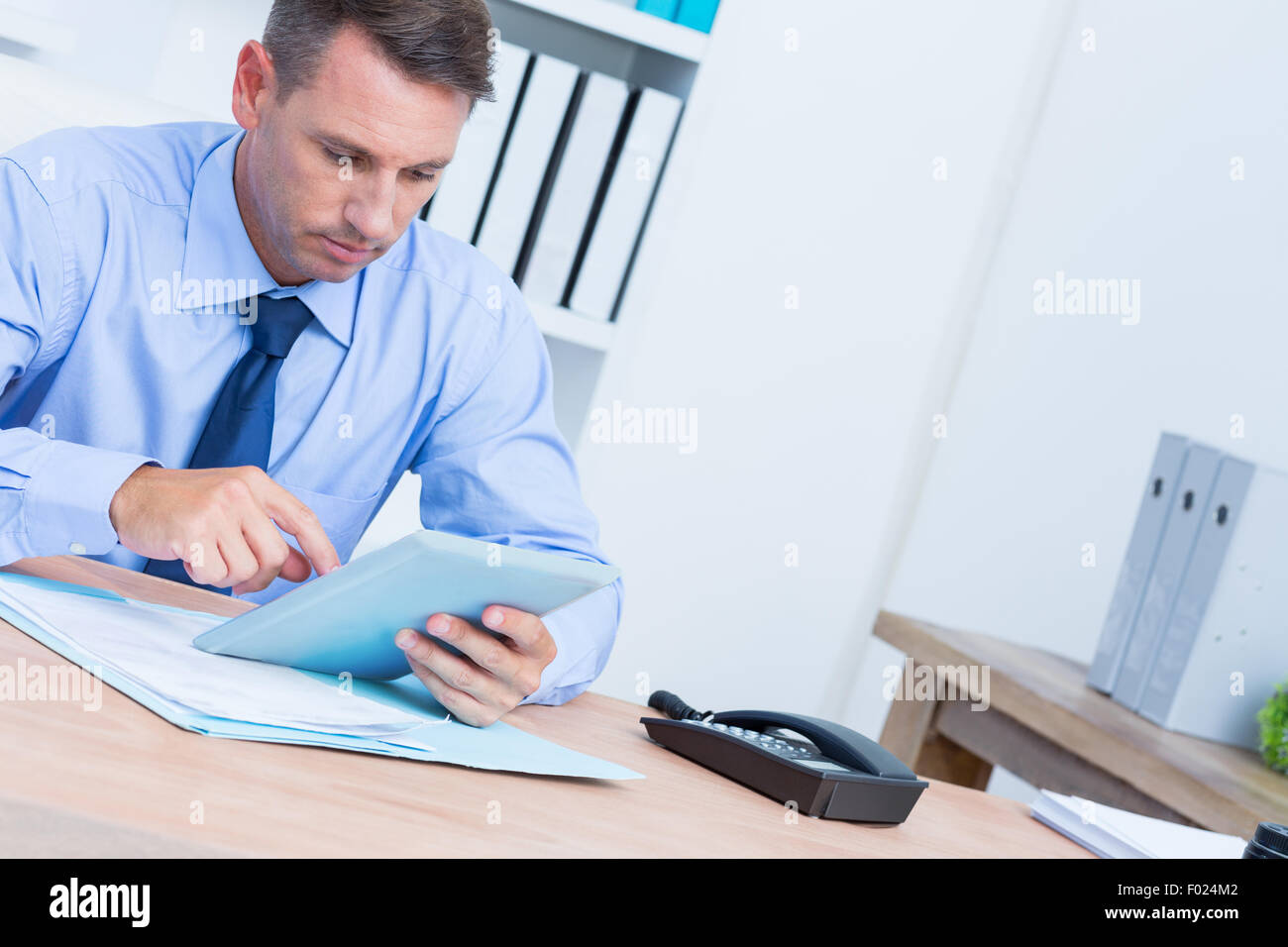 Serious businessman using digital tablet Stock Photo - Alamy Serious businessman using digital tablet Stock Photo - Alamy
