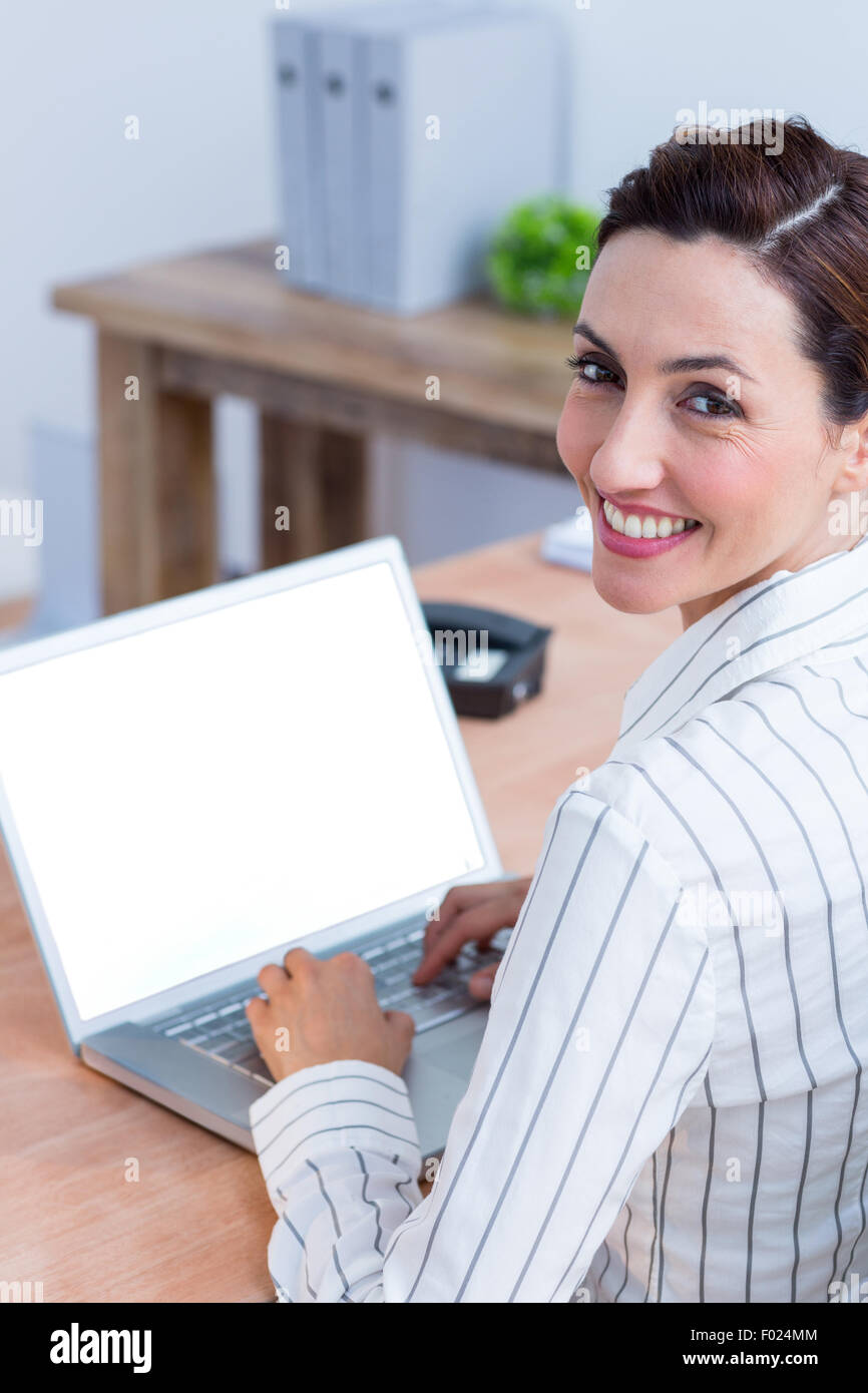 Portrait happy executive using laptop hi-res stock photography and ...
