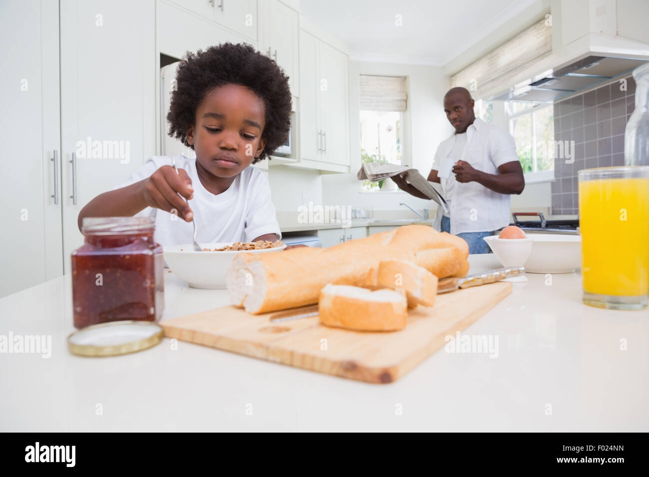 Father and son eating a breakfast Stock Photo - Alamy