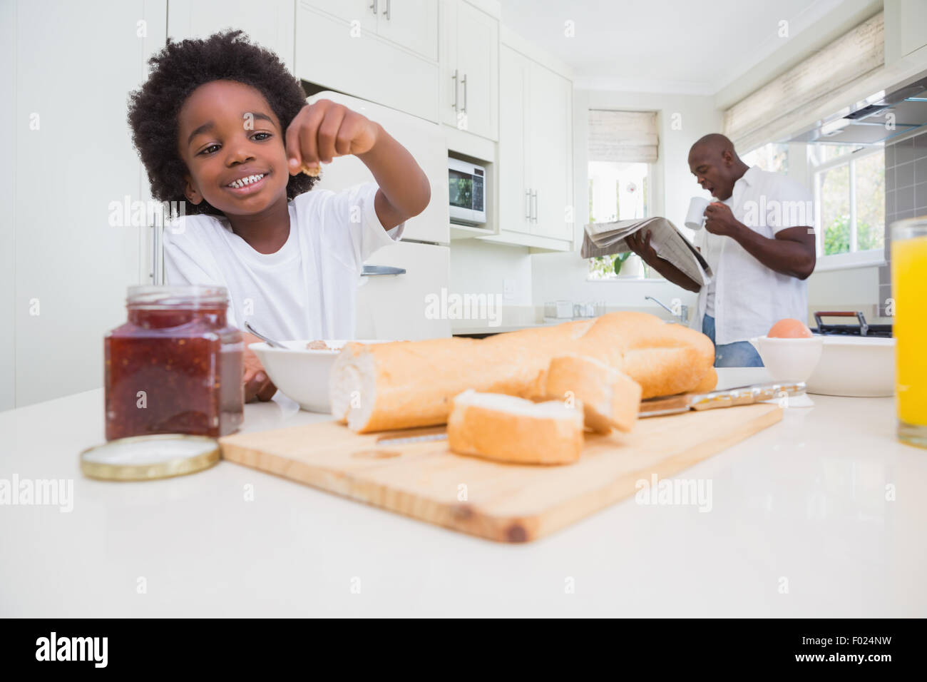 Father and son eating a breakfast Stock Photo - Alamy