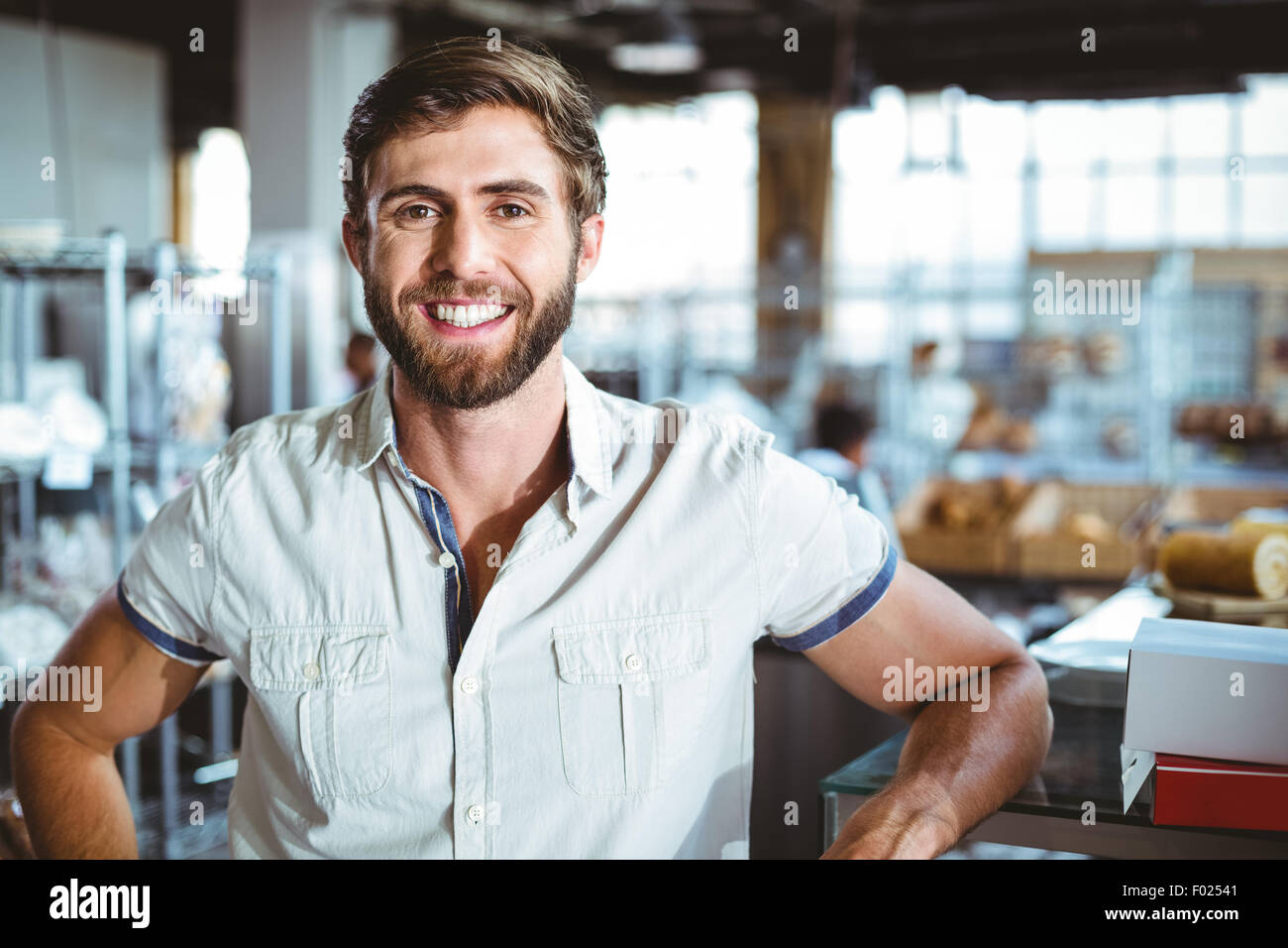 Handsome man leaning on counter hi-res stock photography and images - Alamy