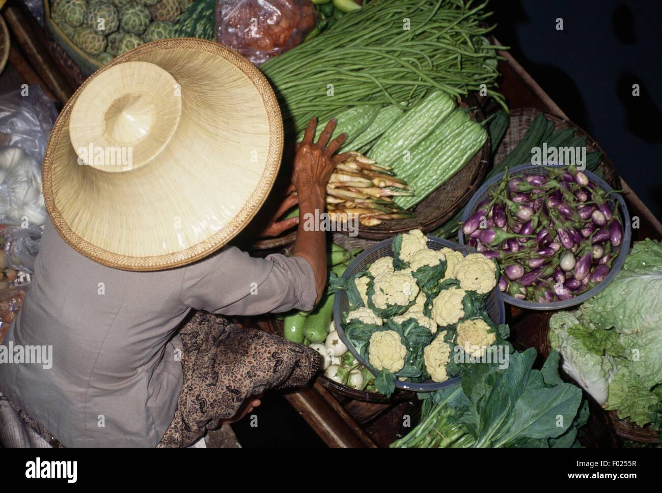 Peasant selling fruit and vegetables at a floating market in Bangkok ...