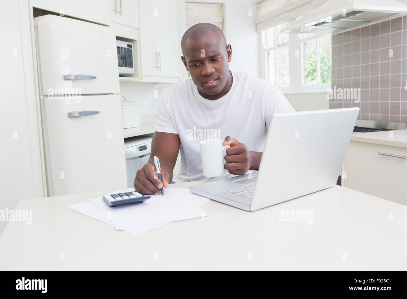 A man working and using his laptop Stock Photo - Alamy