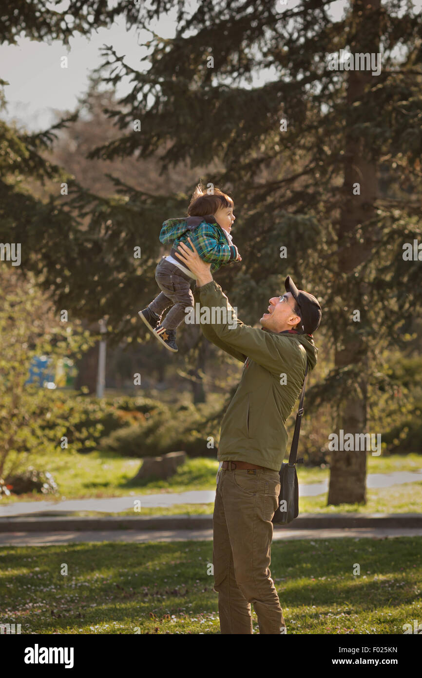 Father throwing his son in the air Stock Photo - Alamy