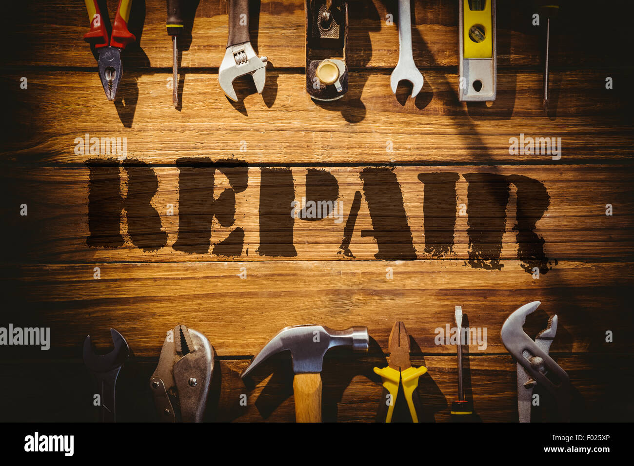 Repair against desk with tools Stock Photo - Alamy