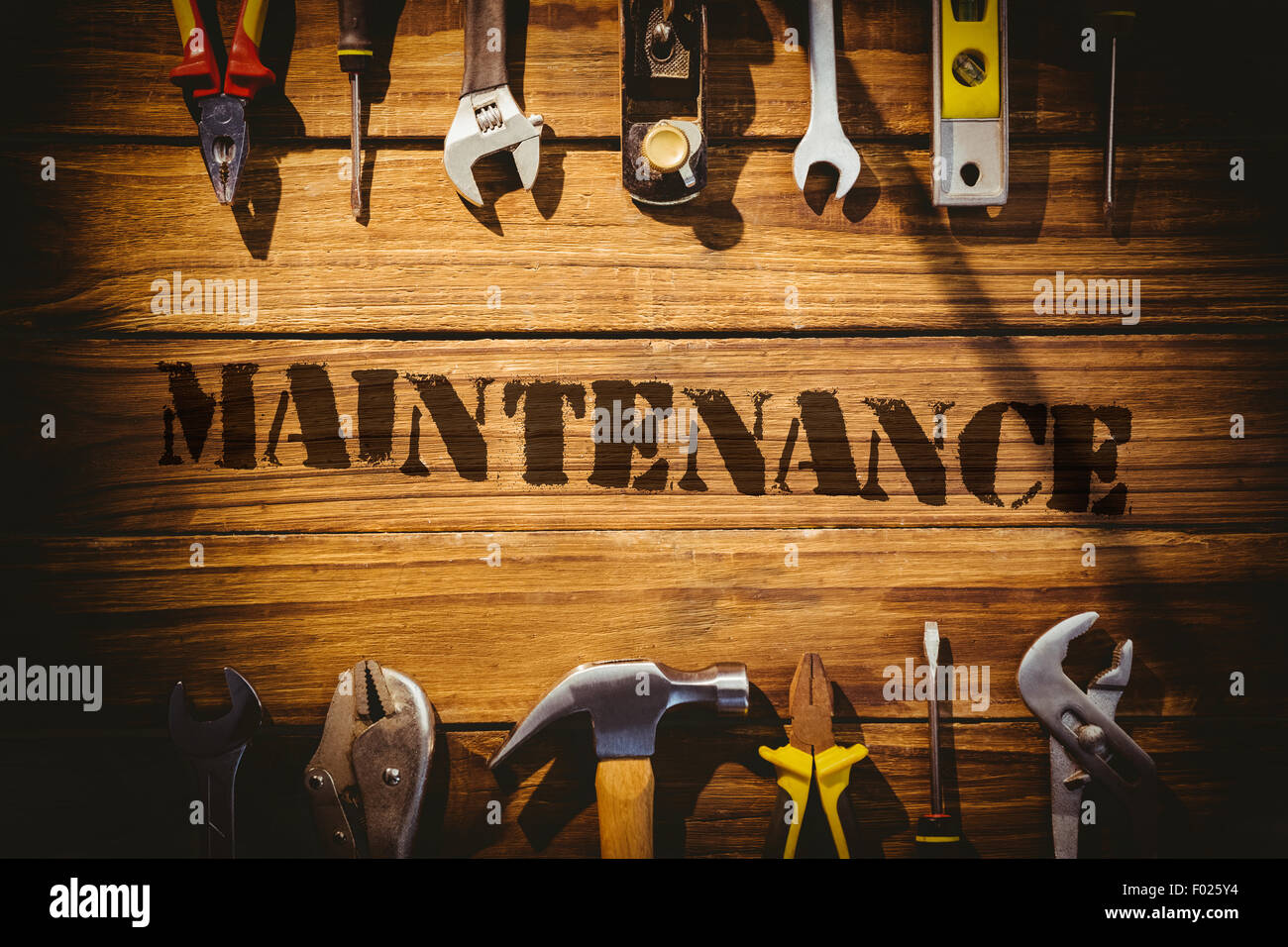Maintenance against desk with tools Stock Photo - Alamy