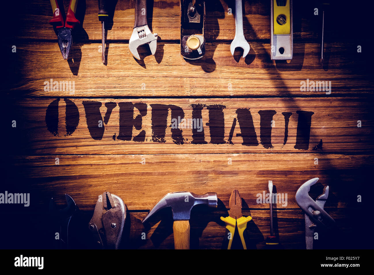 Overhaul against desk with tools Stock Photo - Alamy