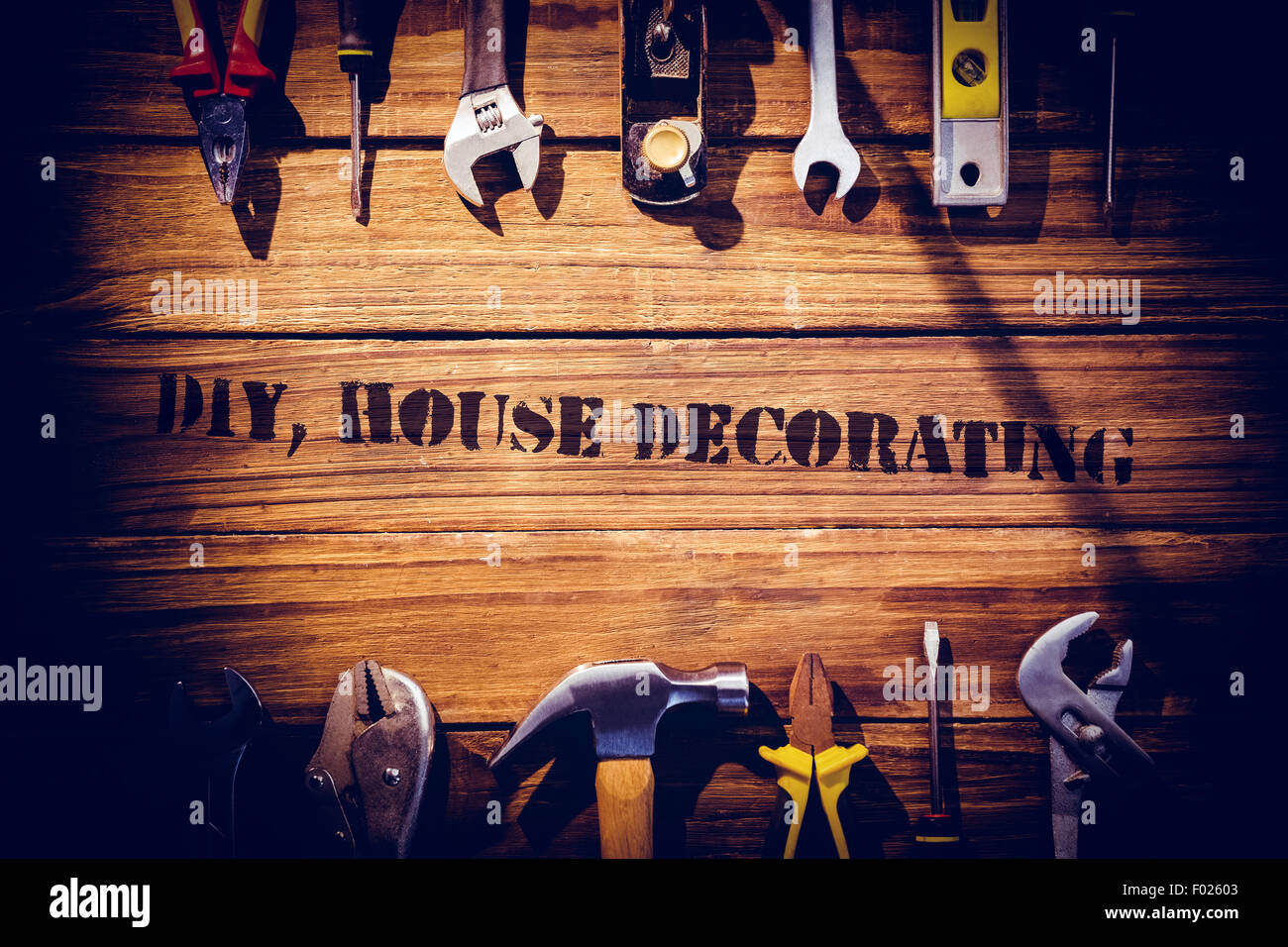 Diy house decorating against desk with tools Stock Photo - Alamy