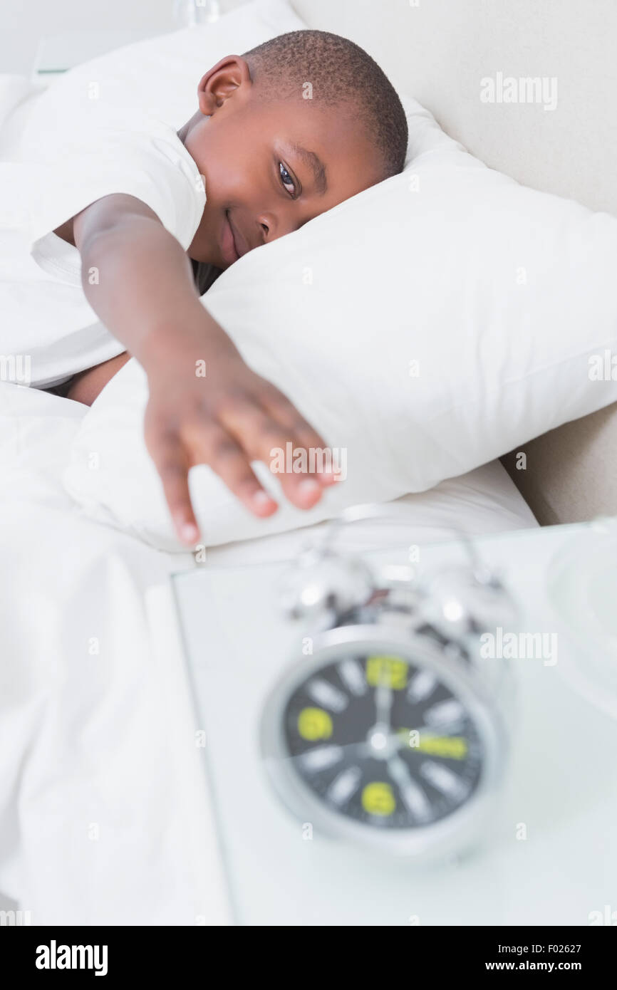 Pretty little boy wake up at morning in bed Stock Photo - Alamy
