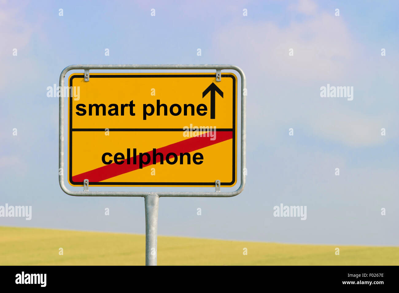 Yellow town sign with text "cellphone smart phone Stock Photo - Alamy