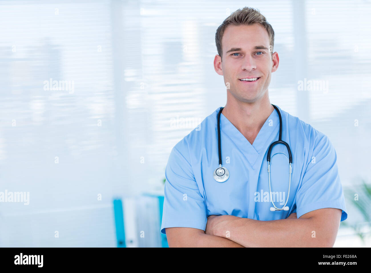 Smiling doctor looking at the camera Stock Photo - Alamy