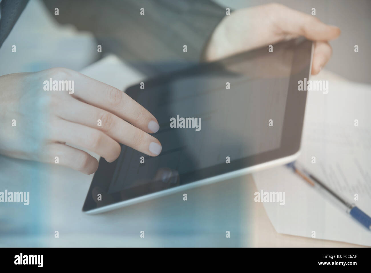 Businesswoman at office working with digital PC behind the window Stock ...