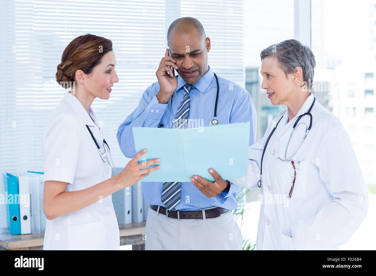 Doctor calling patient hi-res stock photography and images - Alamy