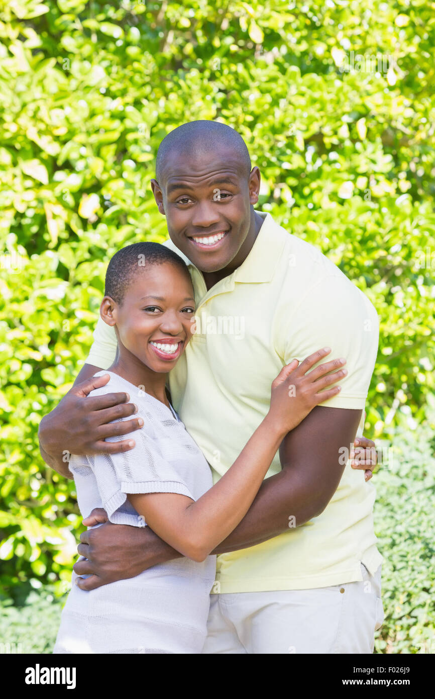 Portrait of a happy smiling couple to hug Stock Photo - Alamy