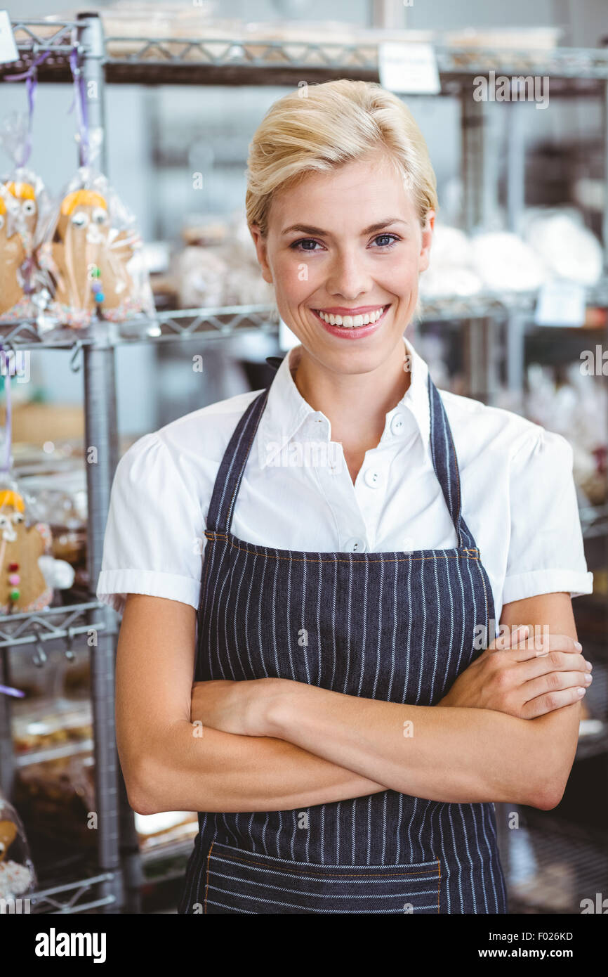 Selfassured female waitress smiling Stock Photo - Alamy