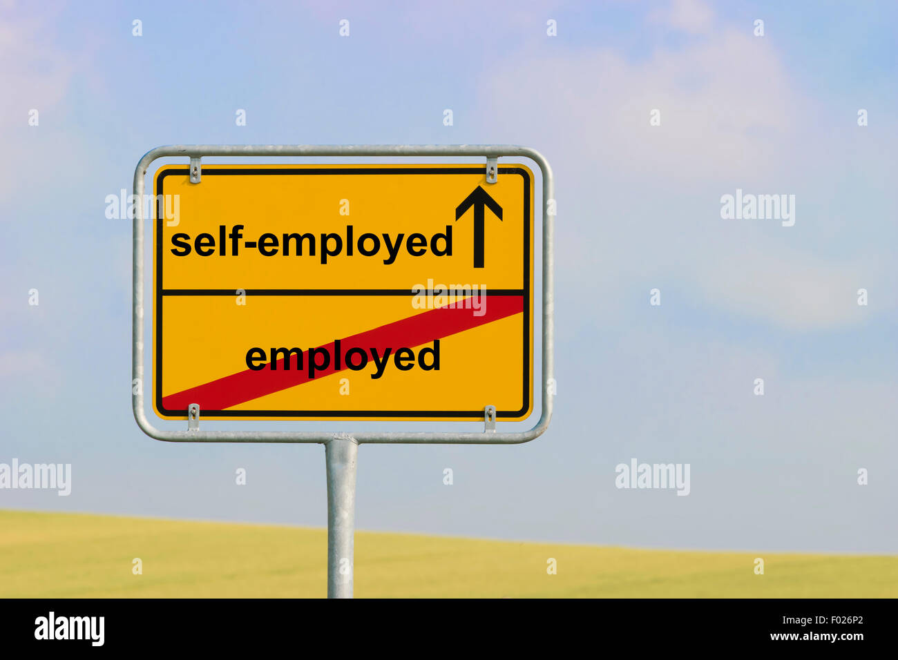 Yellow town sign with text "employed self-employed Stock Photo - Alamy