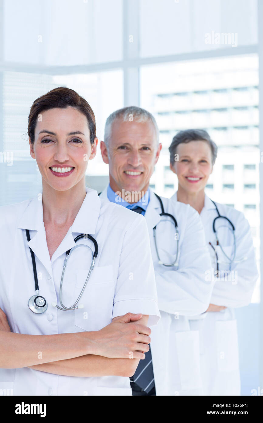 Portrait of three smiling medical colleagues with arms crossed Stock Photo - Alamy