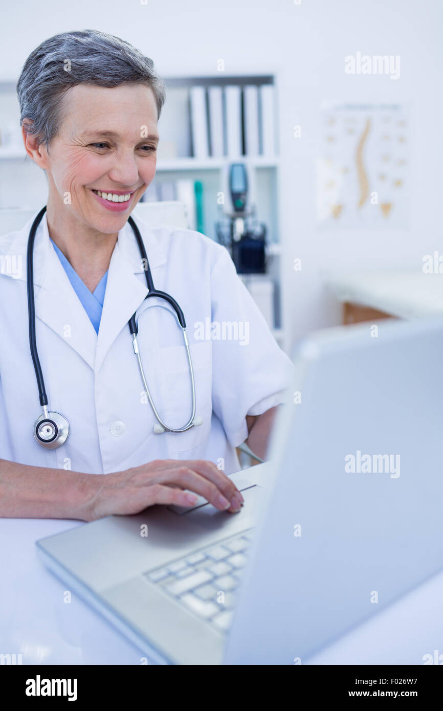 Female doctor using computer typing hi-res stock photography and images ...