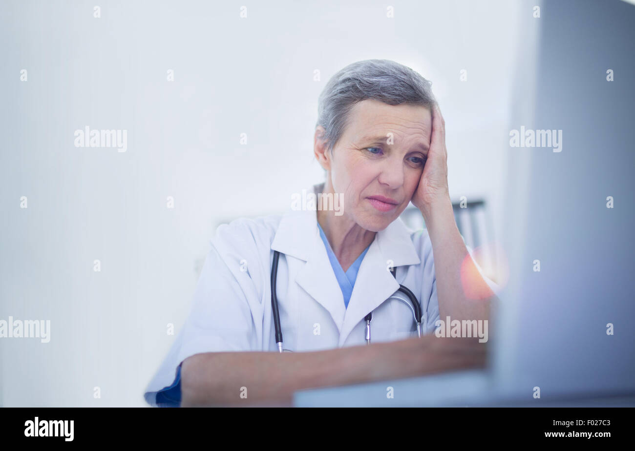 Female doctor using her laptop computer Stock Photo - Alamy