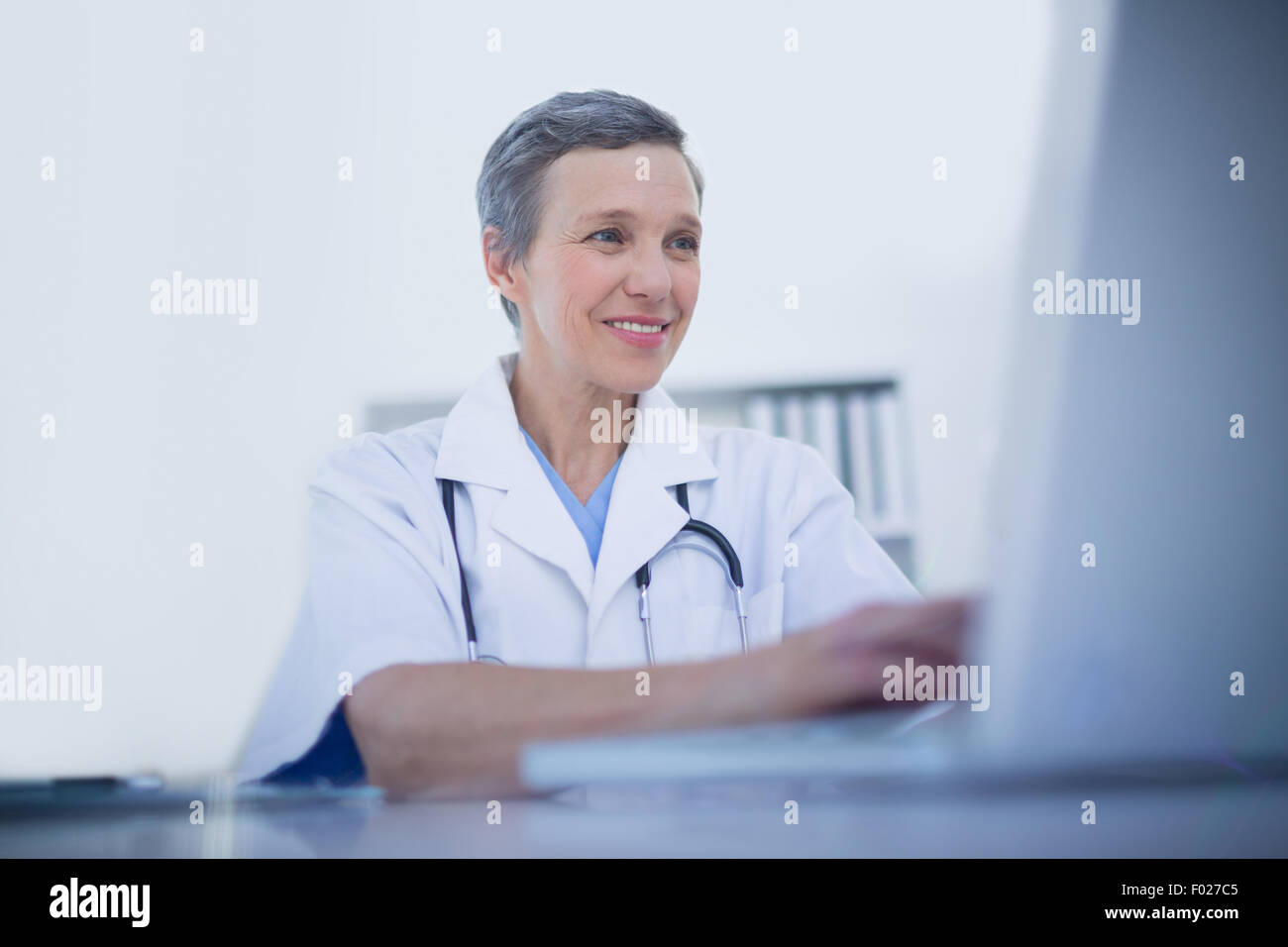 Female doctor using her laptop computer Stock Photo - Alamy