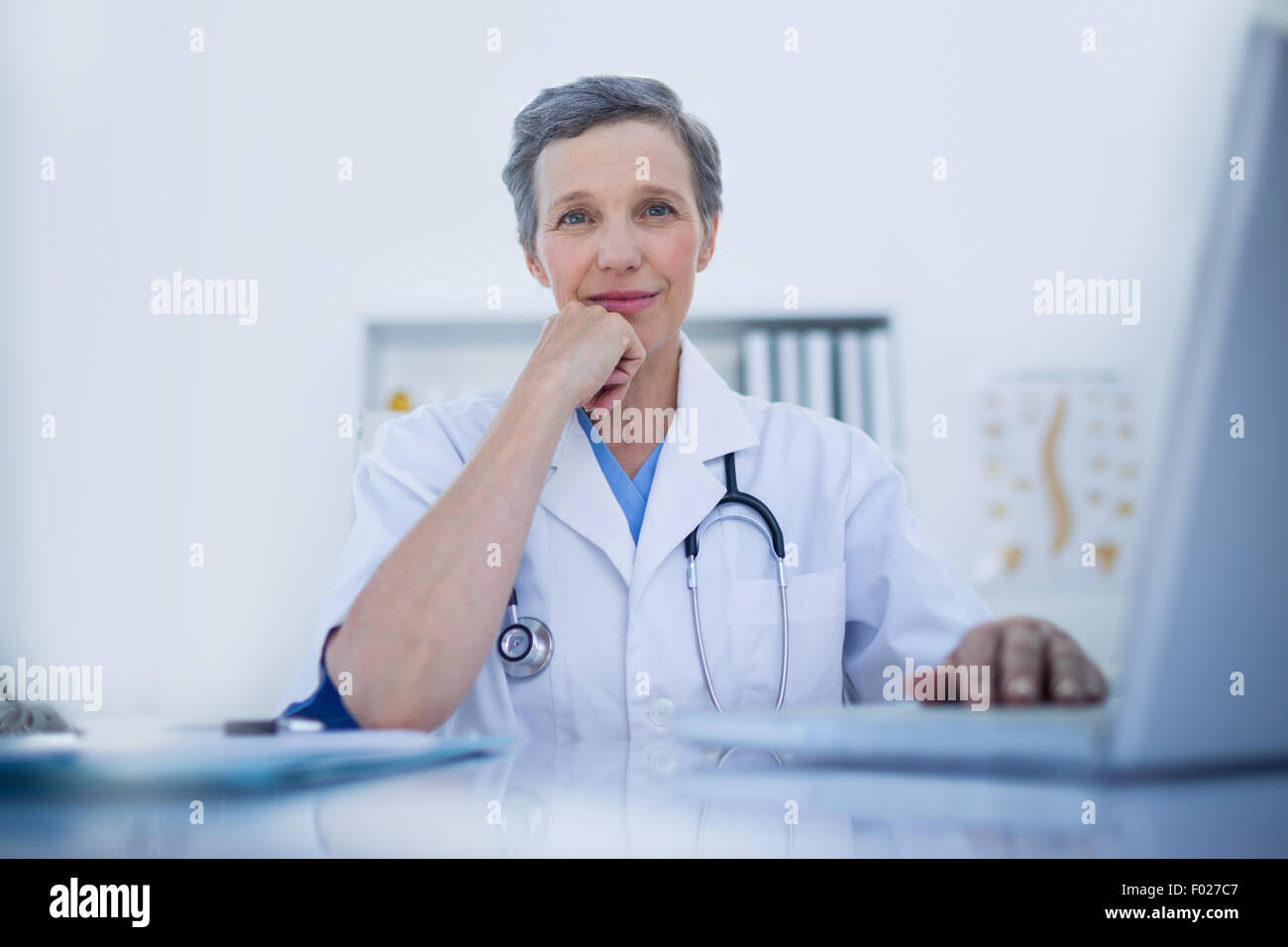 Serious female doctor looking at camera Stock Photo - Alamy