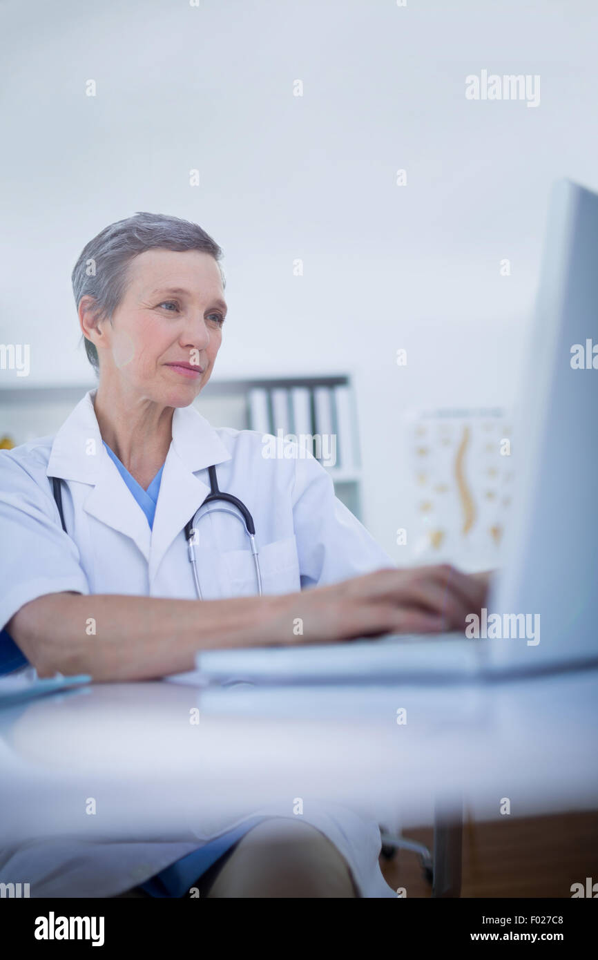 Female doctor using her laptop computer Stock Photo - Alamy