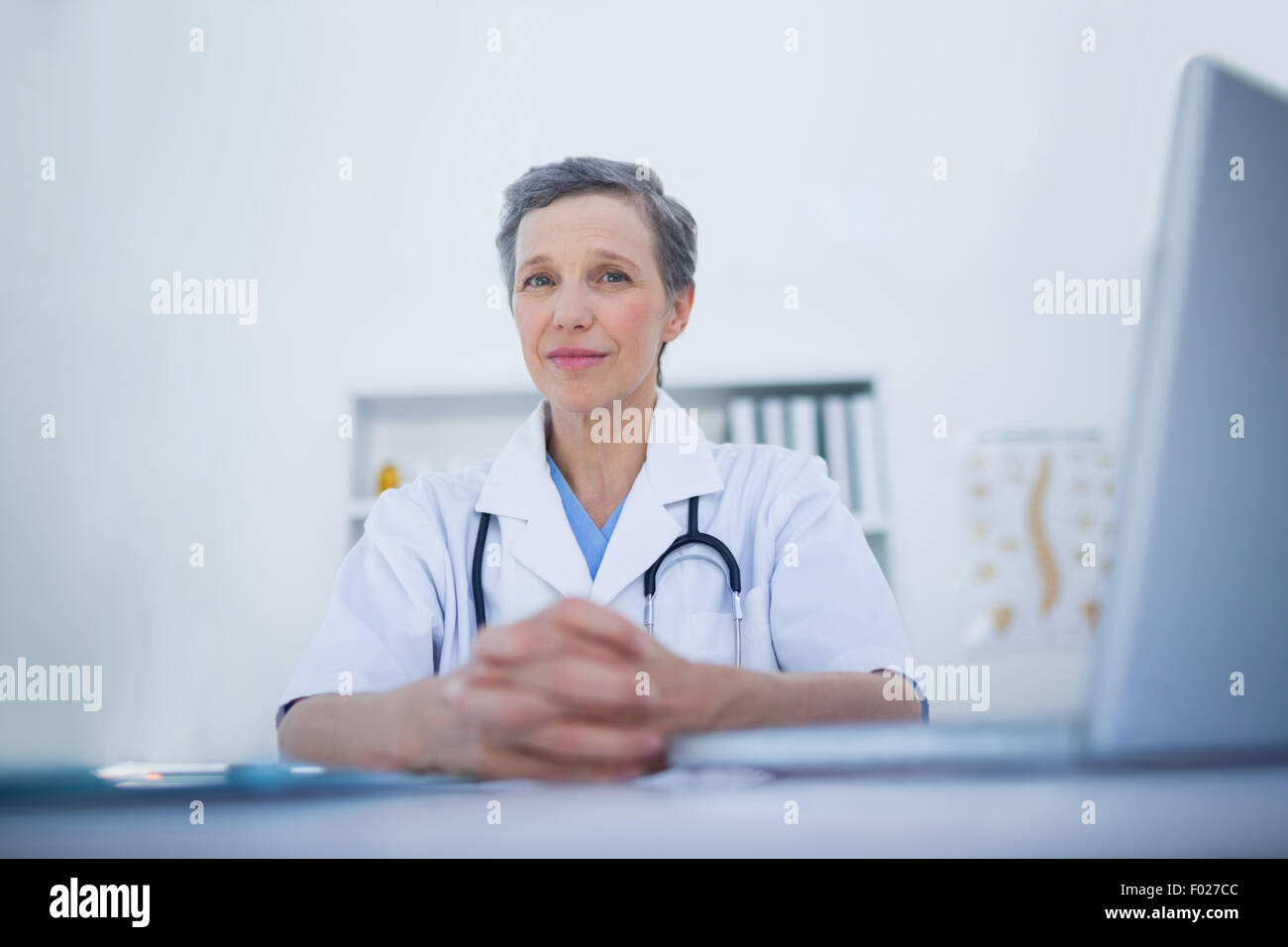 Serious female doctor looking at camera Stock Photo - Alamy