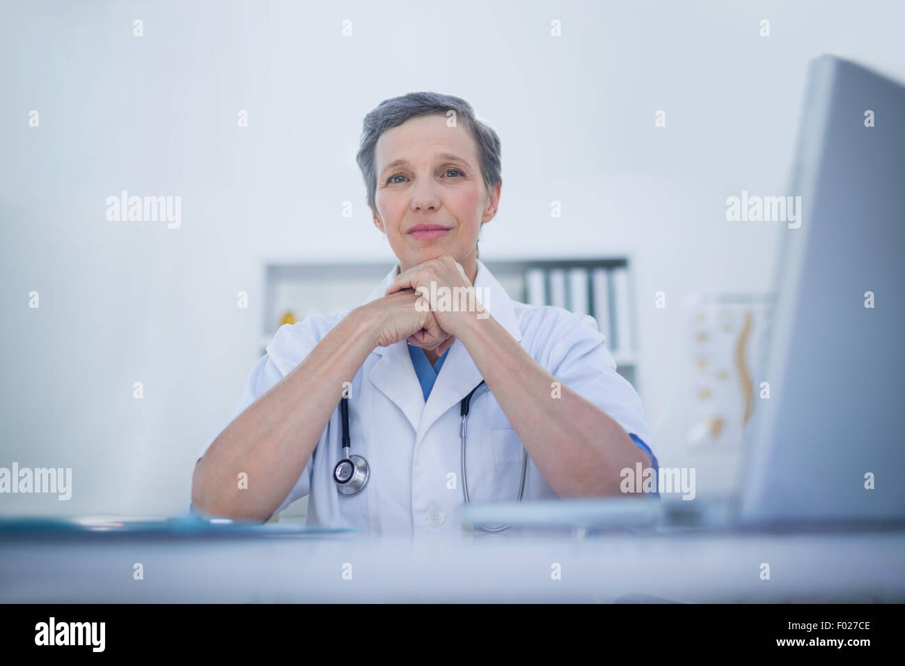 Happy female doctor looking at camera Stock Photo - Alamy