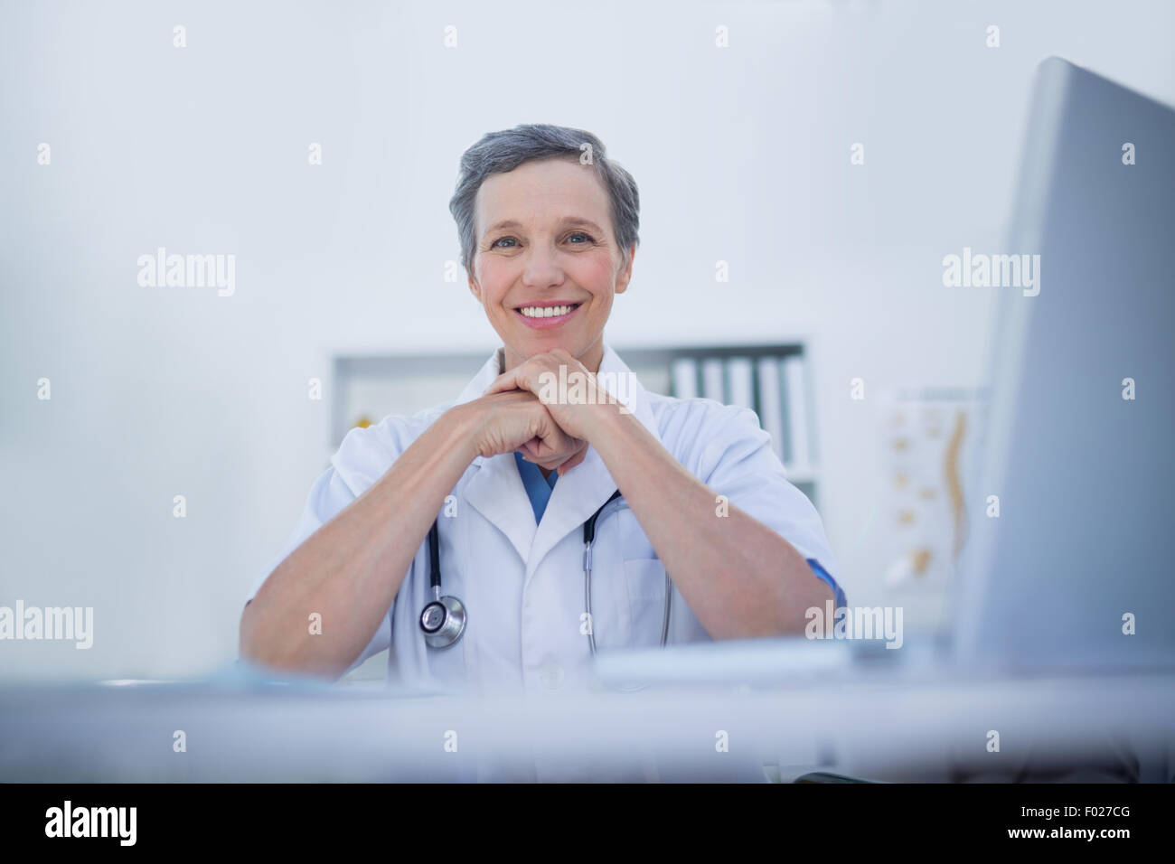 Happy female doctor looking at camera Stock Photo - Alamy