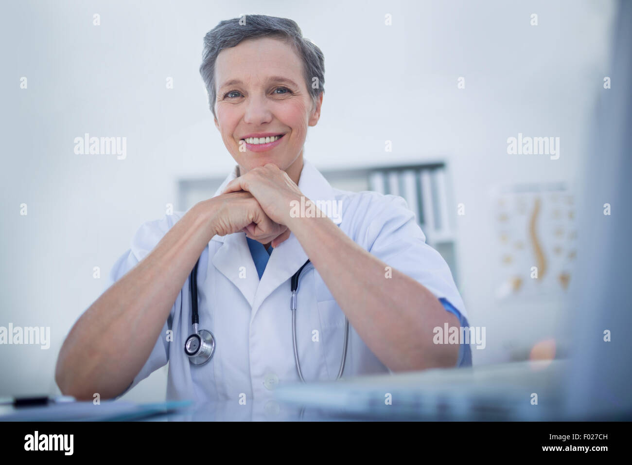 Happy female doctor looking at camera Stock Photo - Alamy