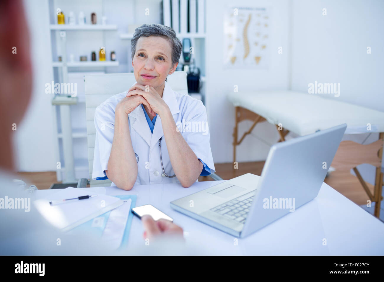 Female doctor speaking with her patient Stock Photo - Alamy