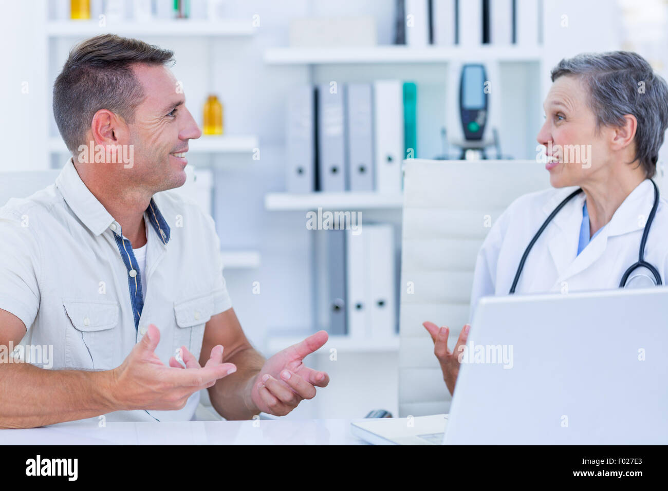 Female doctor speaking with her patient Stock Photo - Alamy