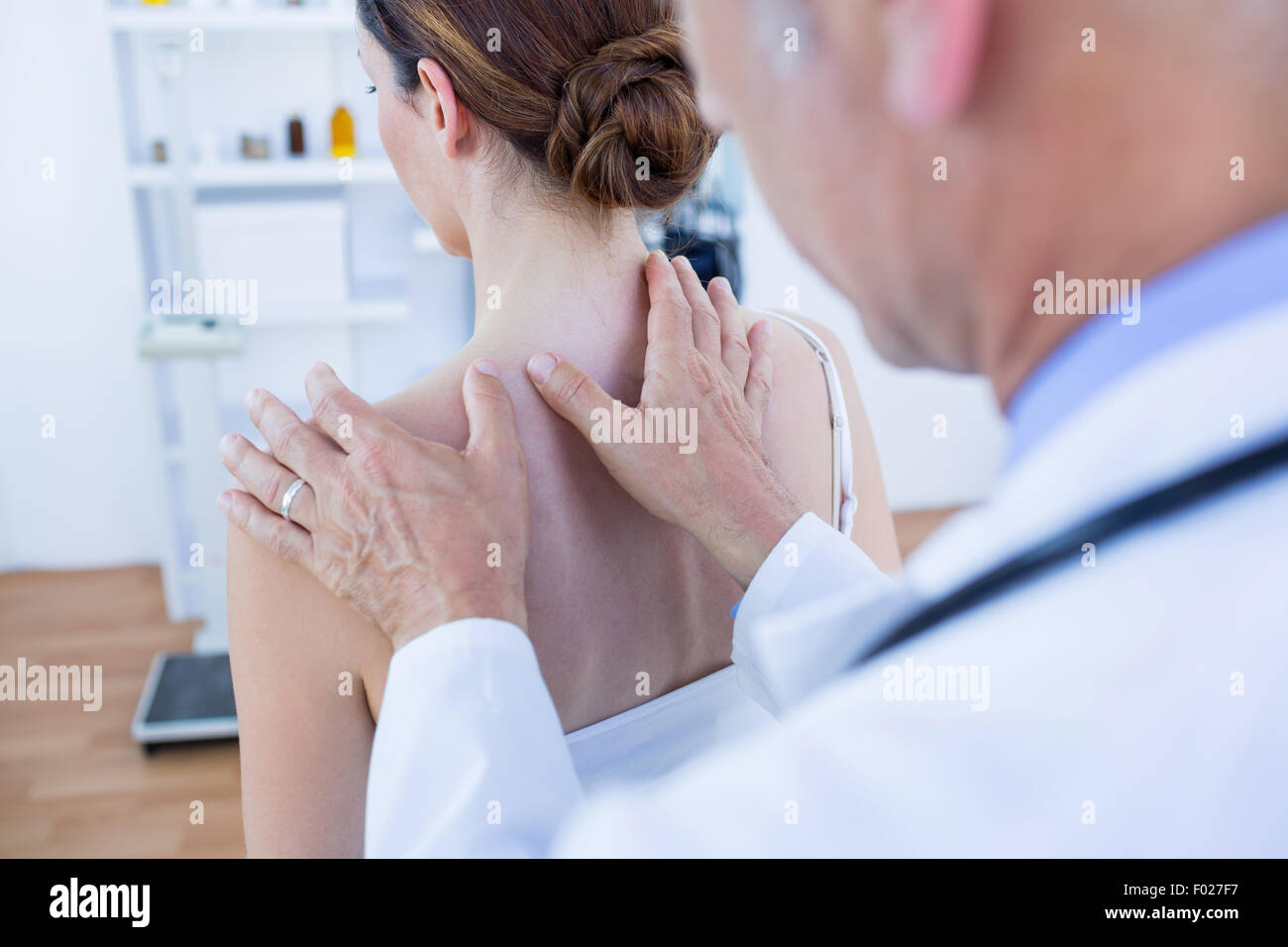 Doctor doing shoulder massage to his patient Stock Photo - Alamy