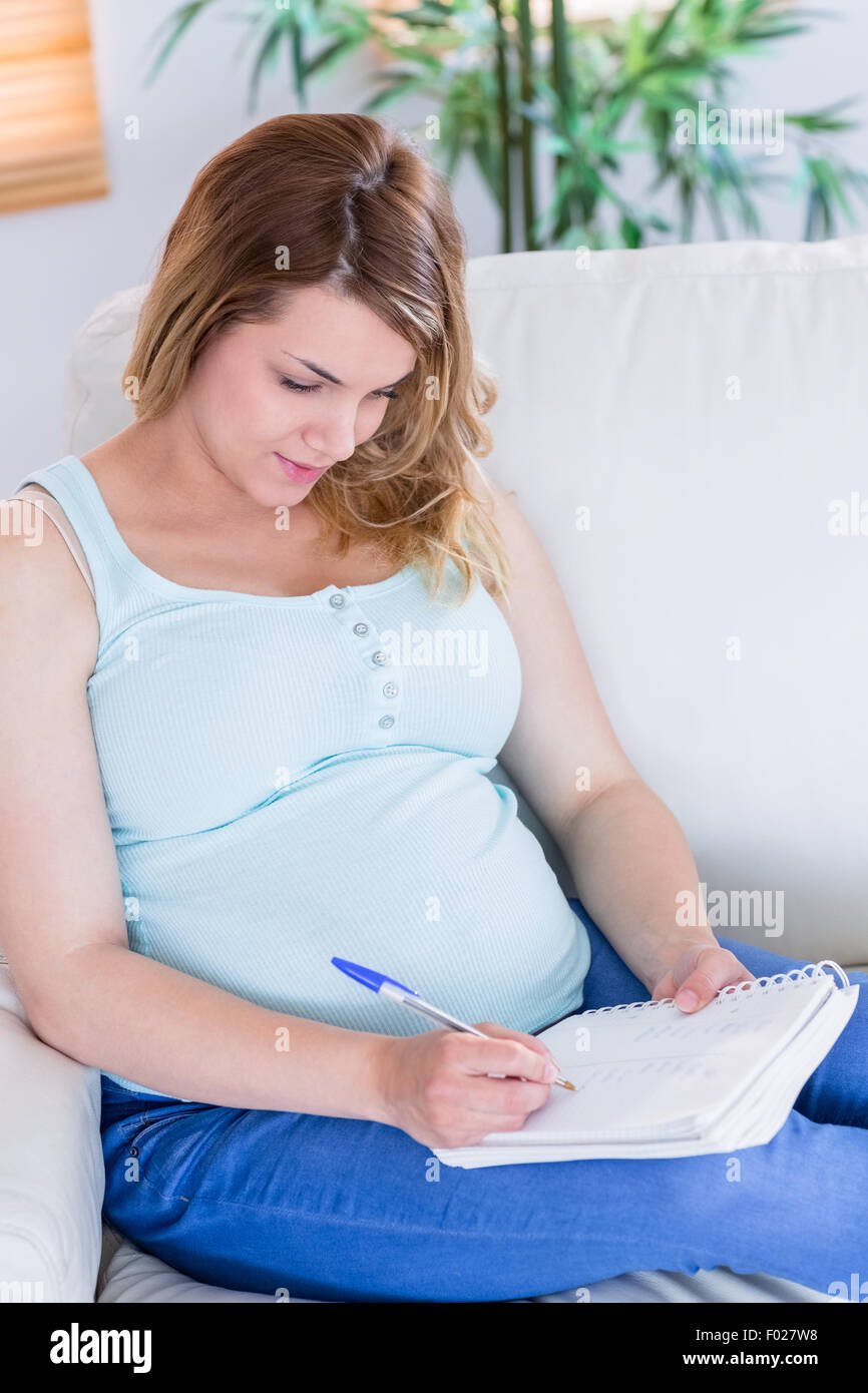 Woman writing down notes hi-res stock photography and images - Alamy